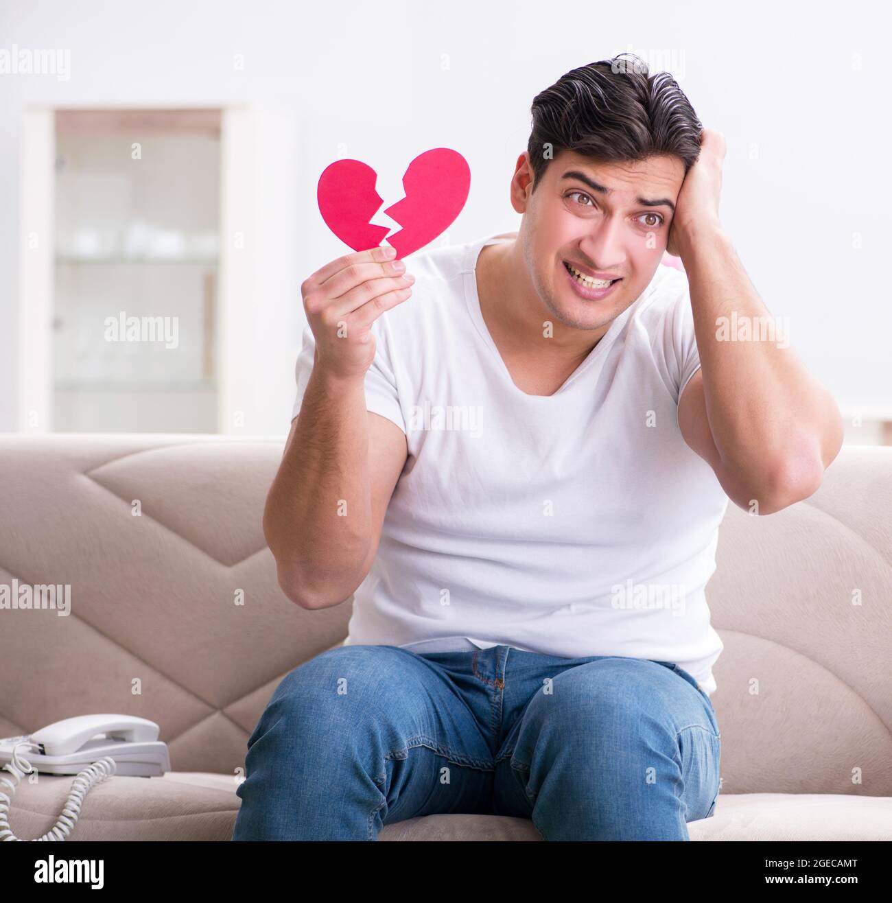 The young man in sad saint valentine concept Stock Photo - Alamy