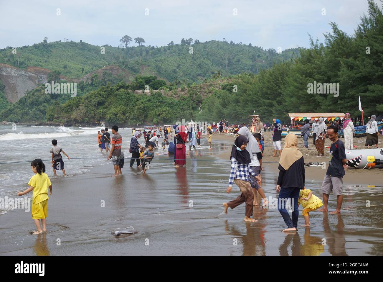 People vacation on Gemah Beach, Tulung Agung, East Java Indonesia Stock ...