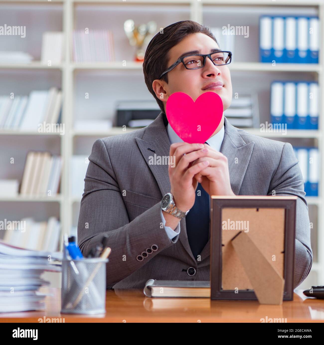 The businessman feeling love and loved in the office Stock Photo - Alamy