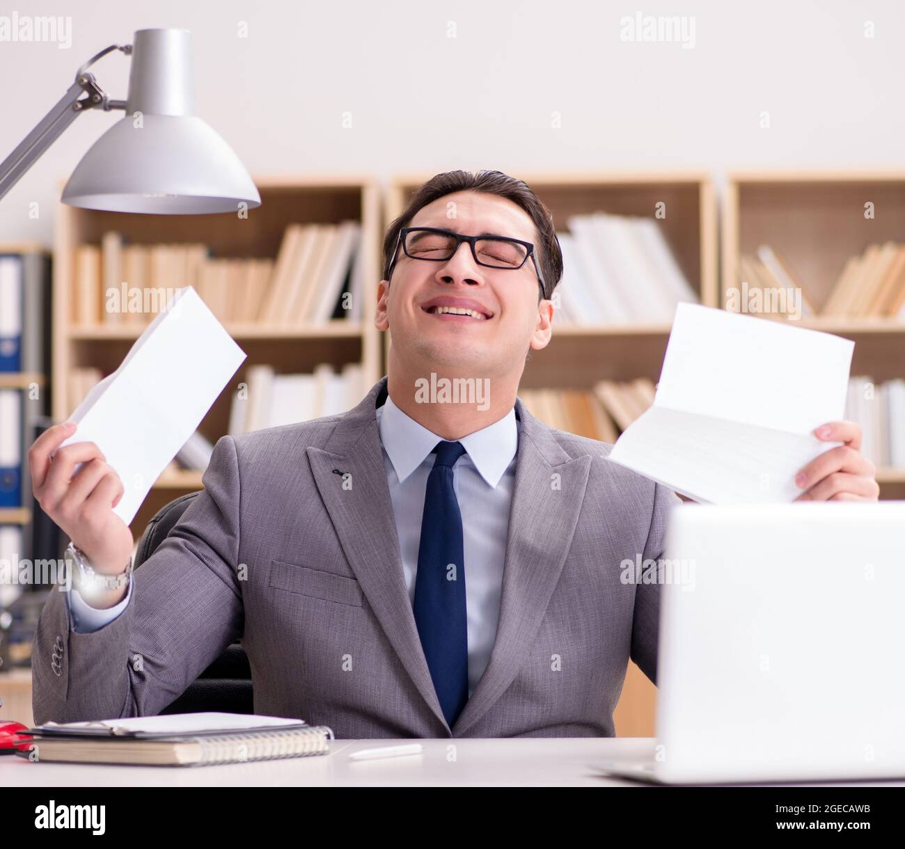 The businessman receiving letter in the office Stock Photo - Alamy