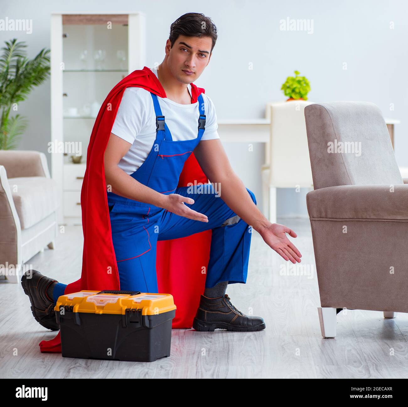 The super hero repairman working at home Stock Photo - Alamy
