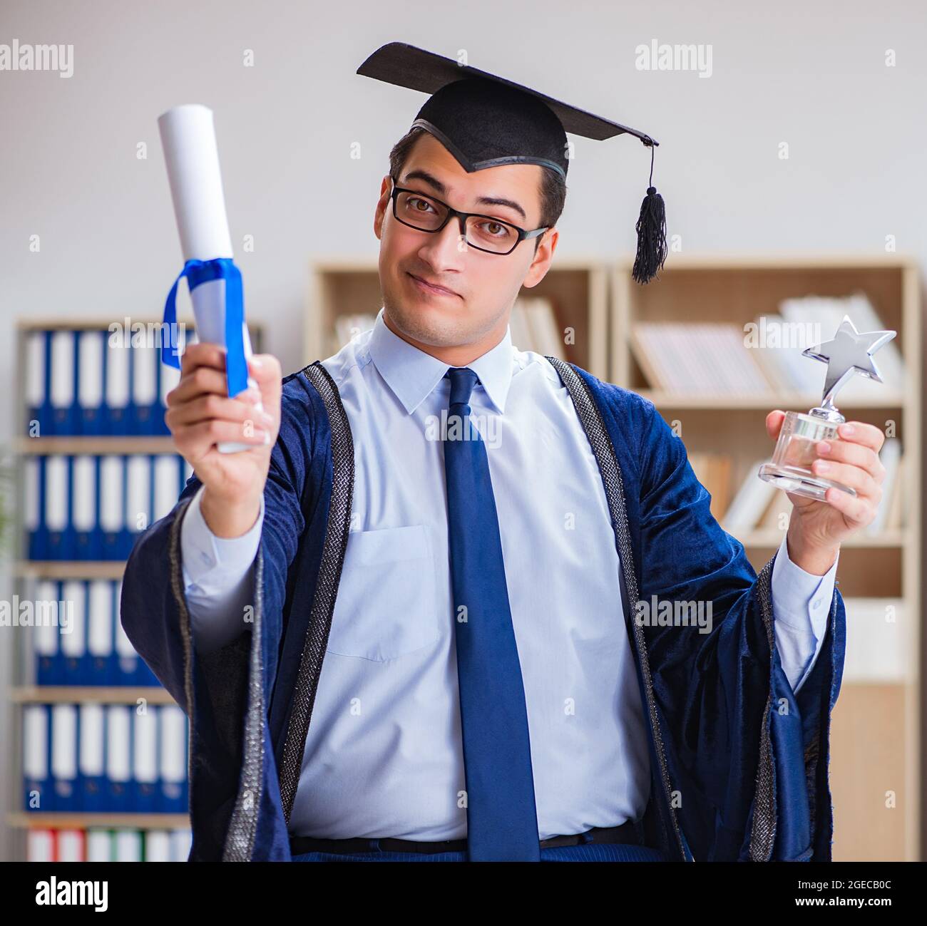 The young man graduating from university Stock Photo - Alamy