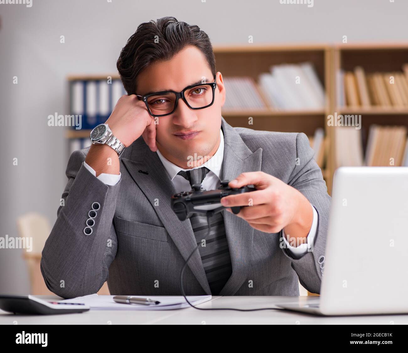 The businessman playing computer games at work office Stock Photo - Alamy