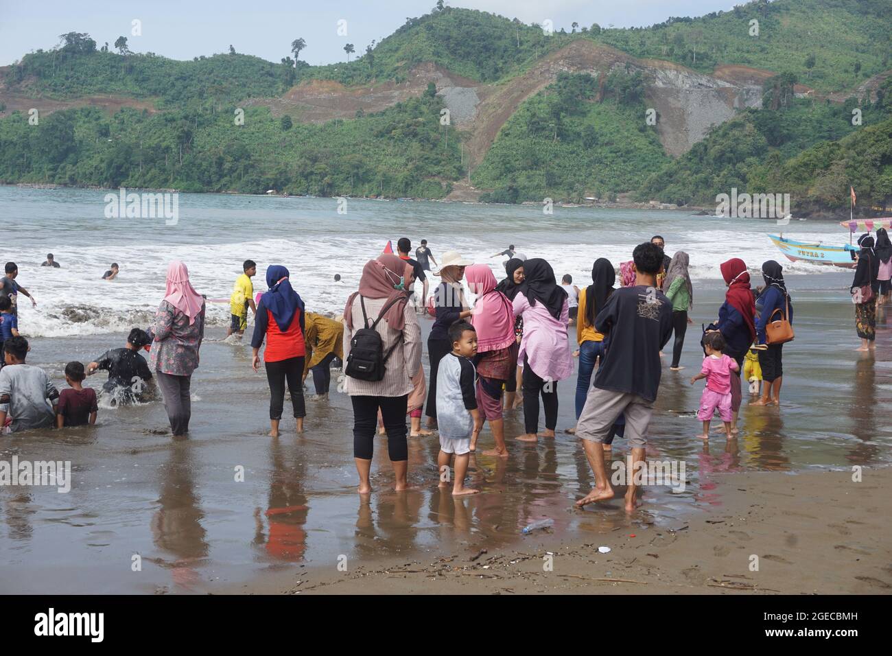People vacation on Gemah Beach, Tulung Agung, East Java Indonesia Stock ...
