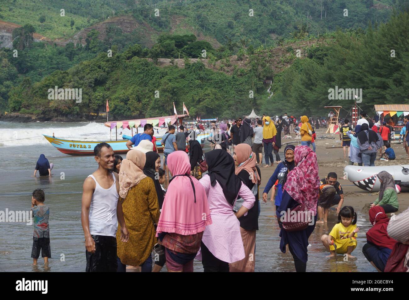 People vacation on Gemah Beach, Tulung Agung, East Java Indonesia Stock ...