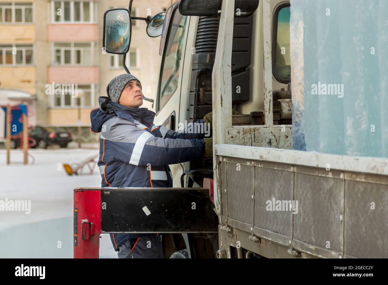 The driver of the hydraulic manipulator in the workplace Stock Photo ...