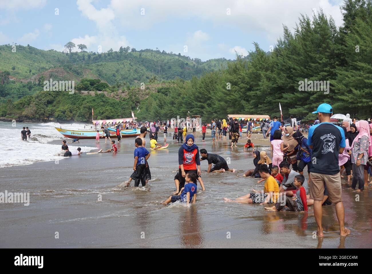 People vacation on Gemah Beach, Tulung Agung, East Java Indonesia Stock ...