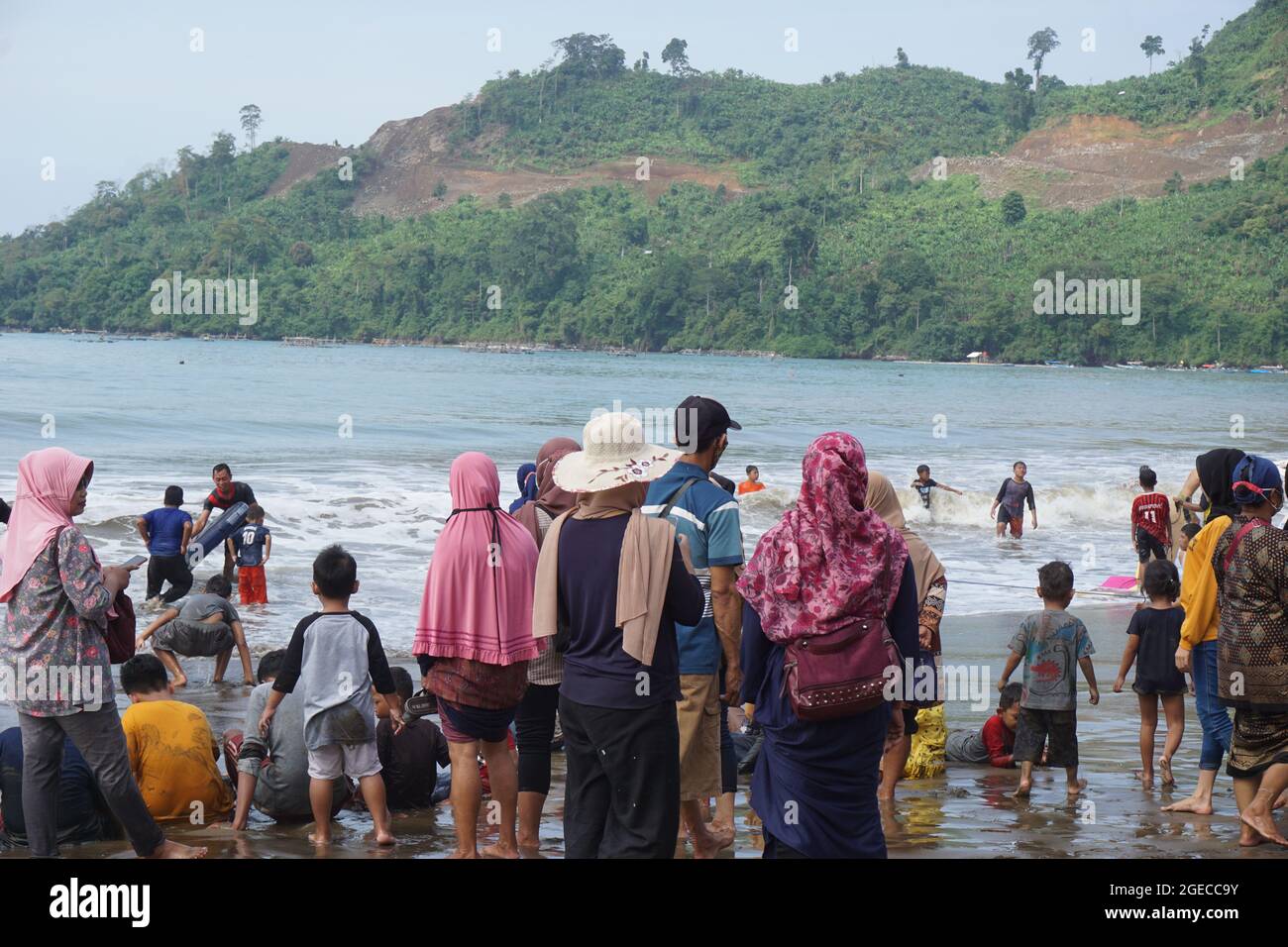 People vacation on Gemah Beach, Tulung Agung, East Java Indonesia Stock ...