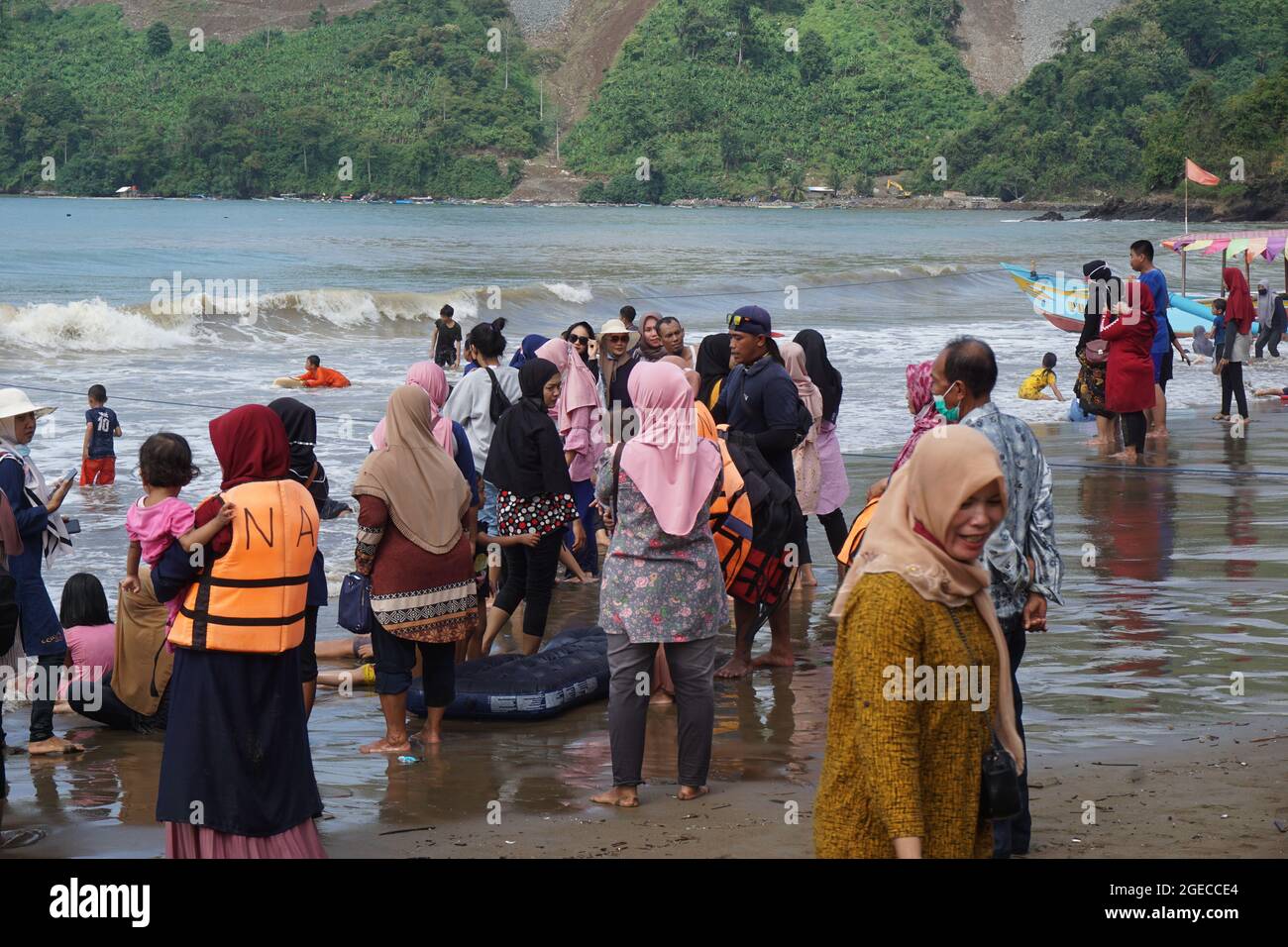 People vacation on Gemah Beach, Tulung Agung, East Java Indonesia Stock ...