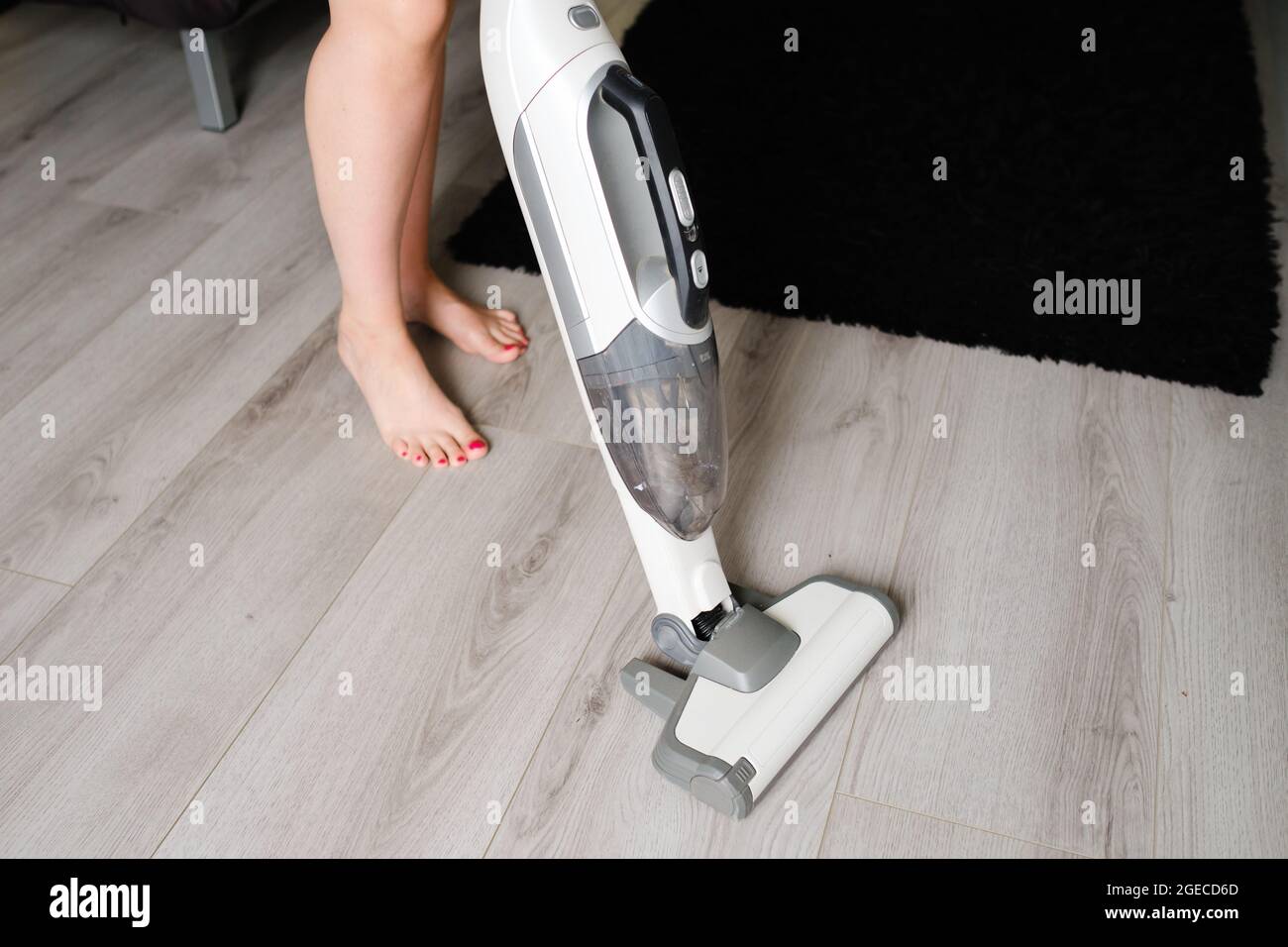 Woman vacuuming in living room hi-res stock photography and images - Alamy