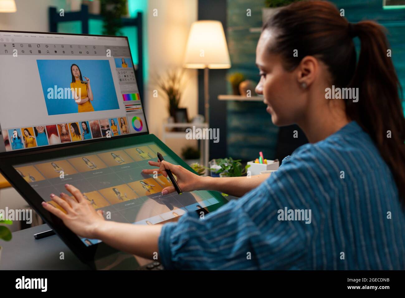 Professional editor doing retouching work on image for design project ...