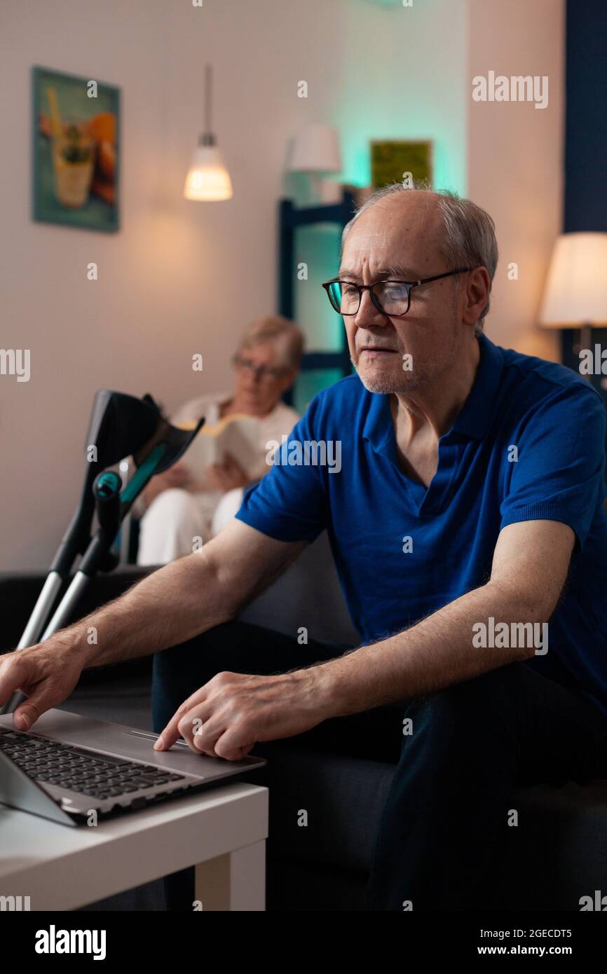 Senior elderly people enjoying retirement in living room at home ...
