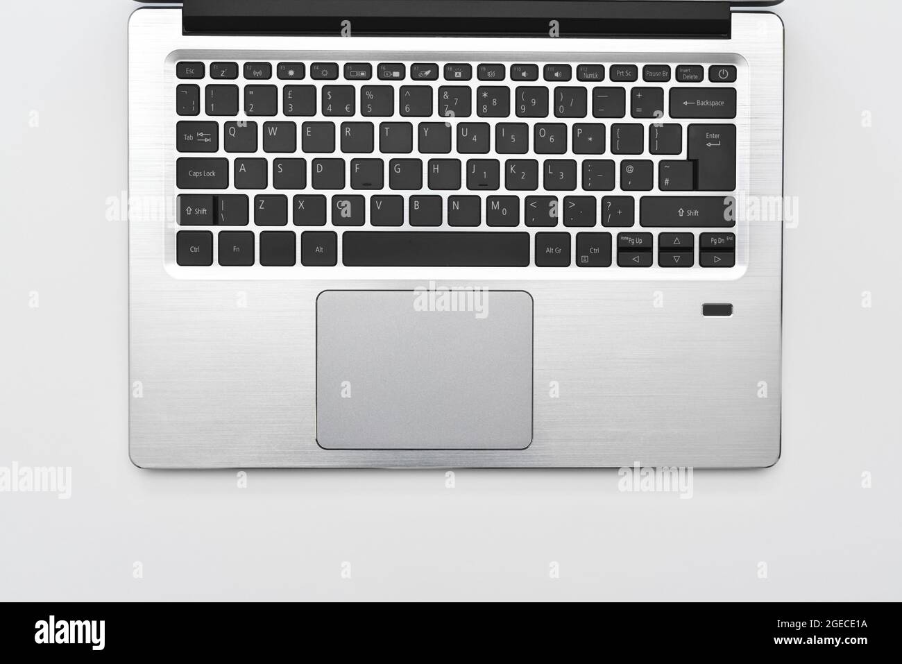 Keyboard of a modern compact laptop with English layout and touchpad ...