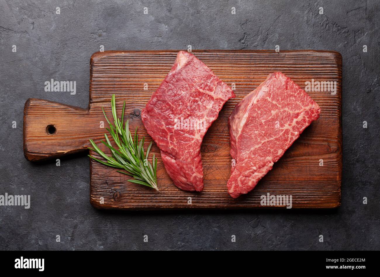 Marbled beef steak. Two fresh raw fillet steaks on cutting board. Top ...