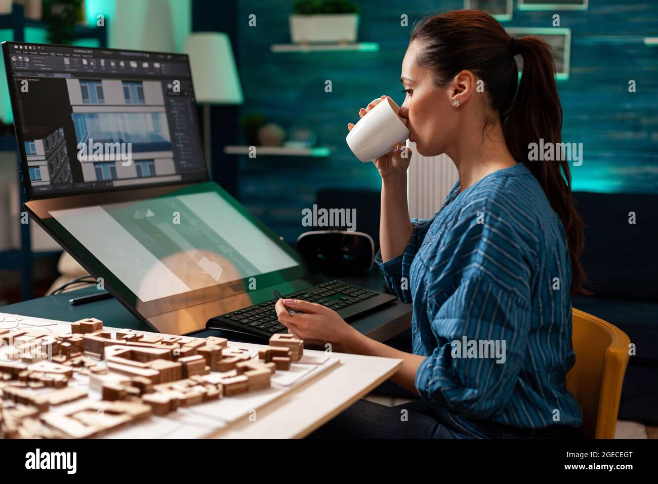 Engineering project designer looking at digital blueprint on computer ...