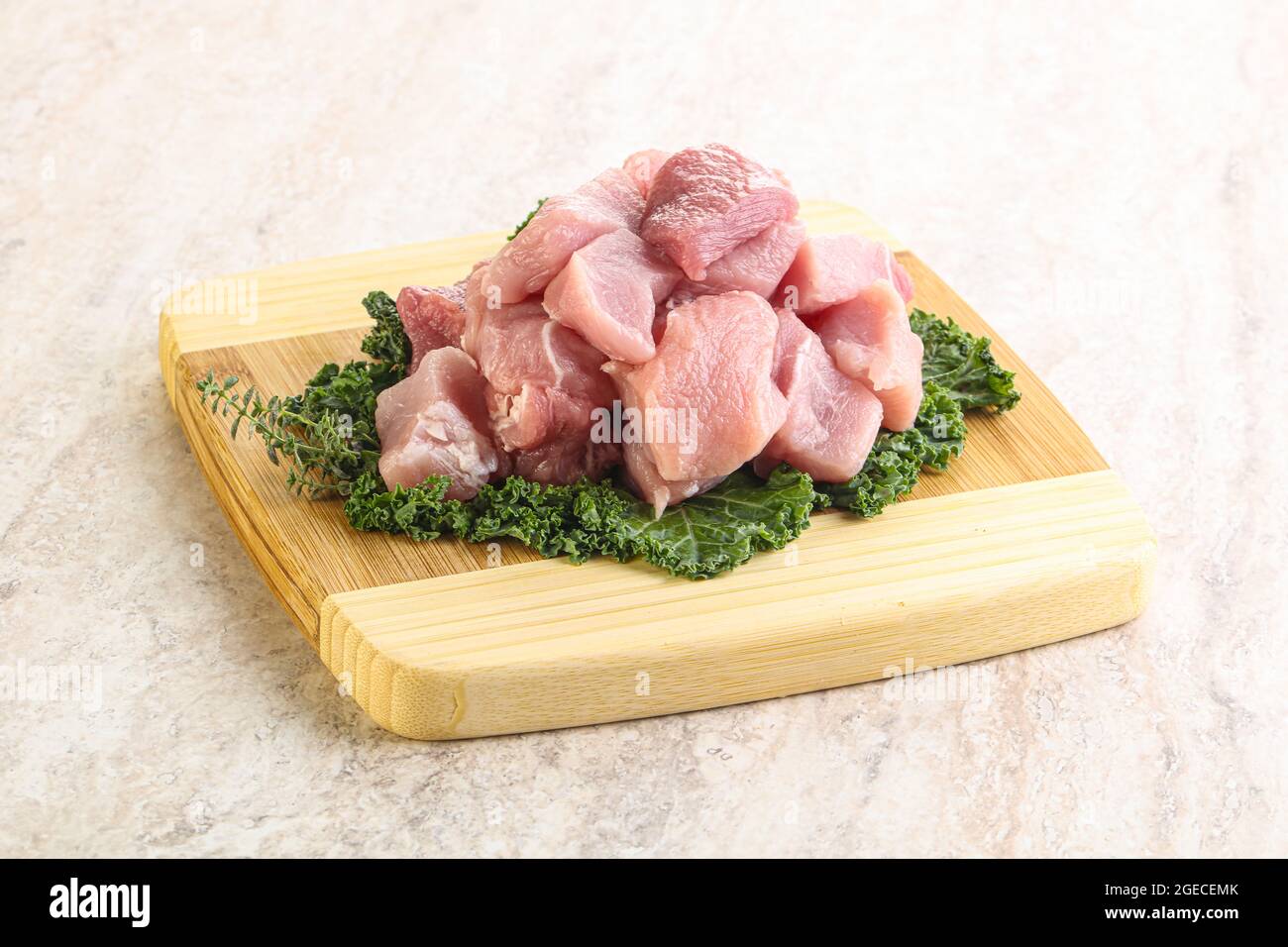 Raw pork meat cubes for coocking over board Stock Photo - Alamy