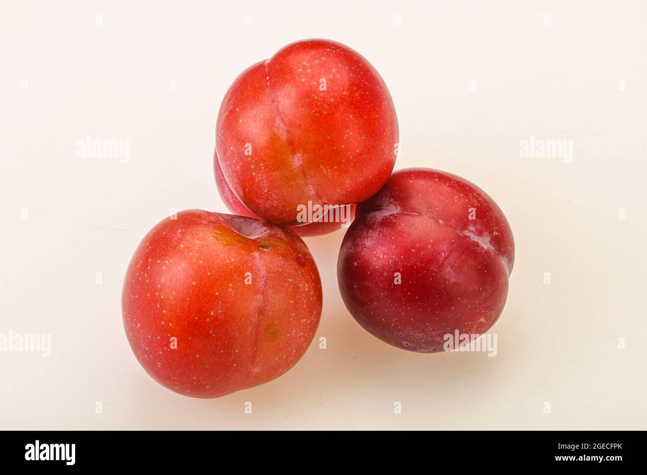 Ripe sweet tasty red plum heap Stock Photo - Alamy