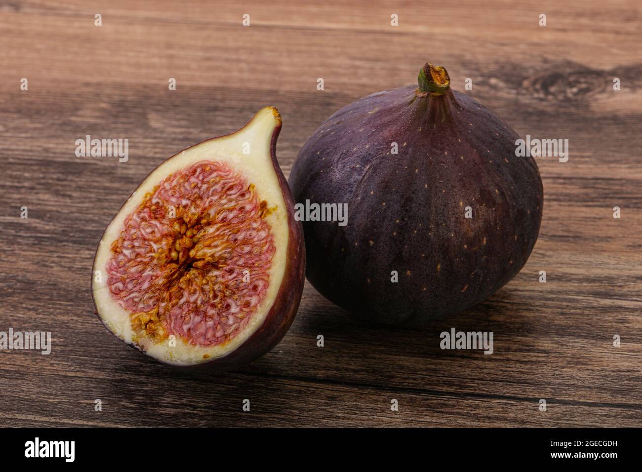 Sweet purple slice of fig fruit Stock Photo - Alamy