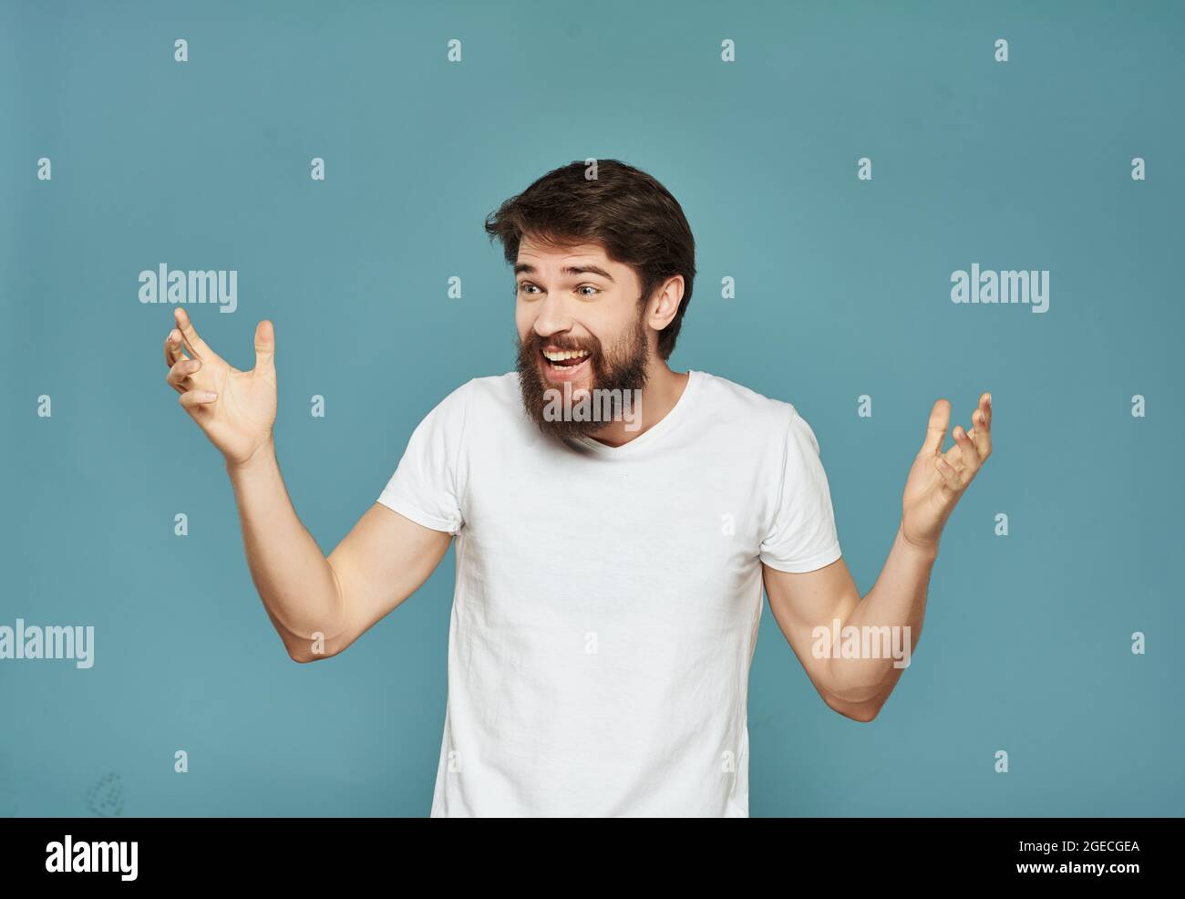 bearded man in a white t-shirt hand gestures anger Lifestyle Stock ...