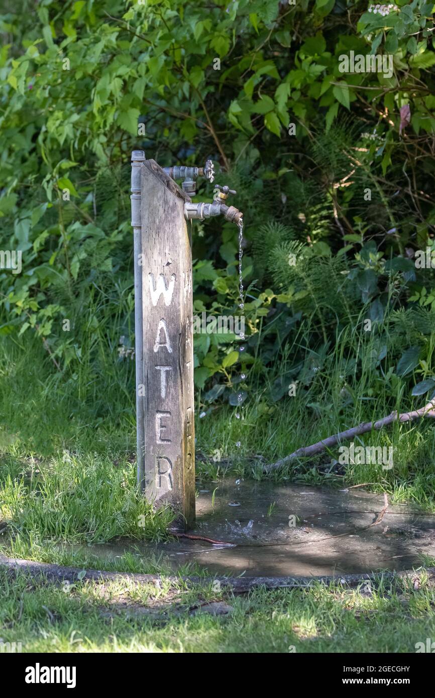 A fresh tap water source on a hiking trail in a state park in ...