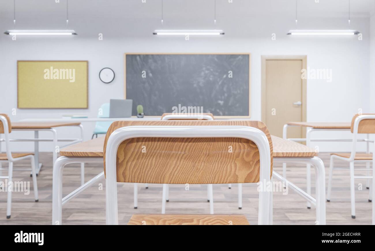 close up of school chair from behind in a classroom with blurred ...