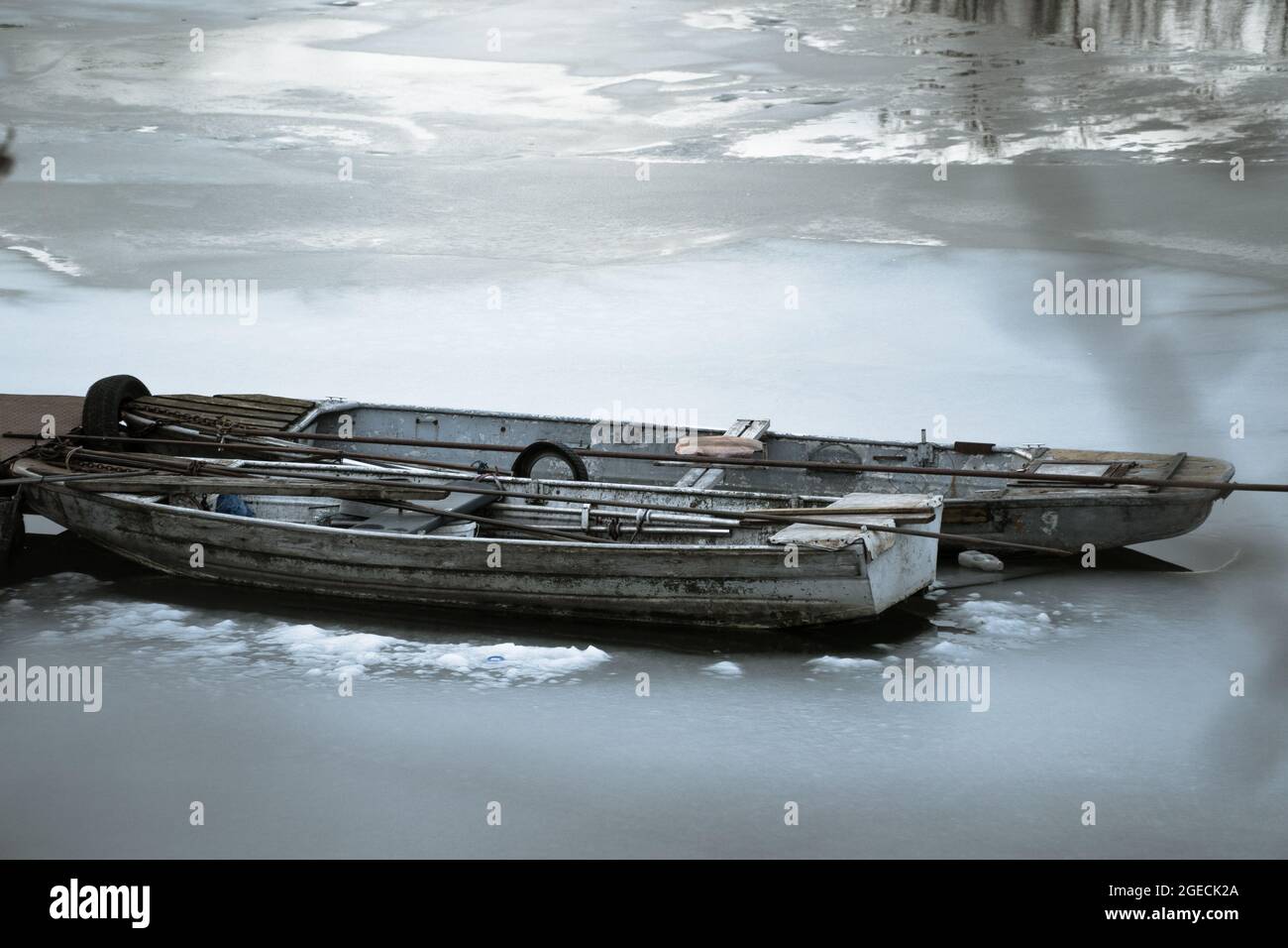 small boats on frozen water during winter in dock Stock Photo - Alamy