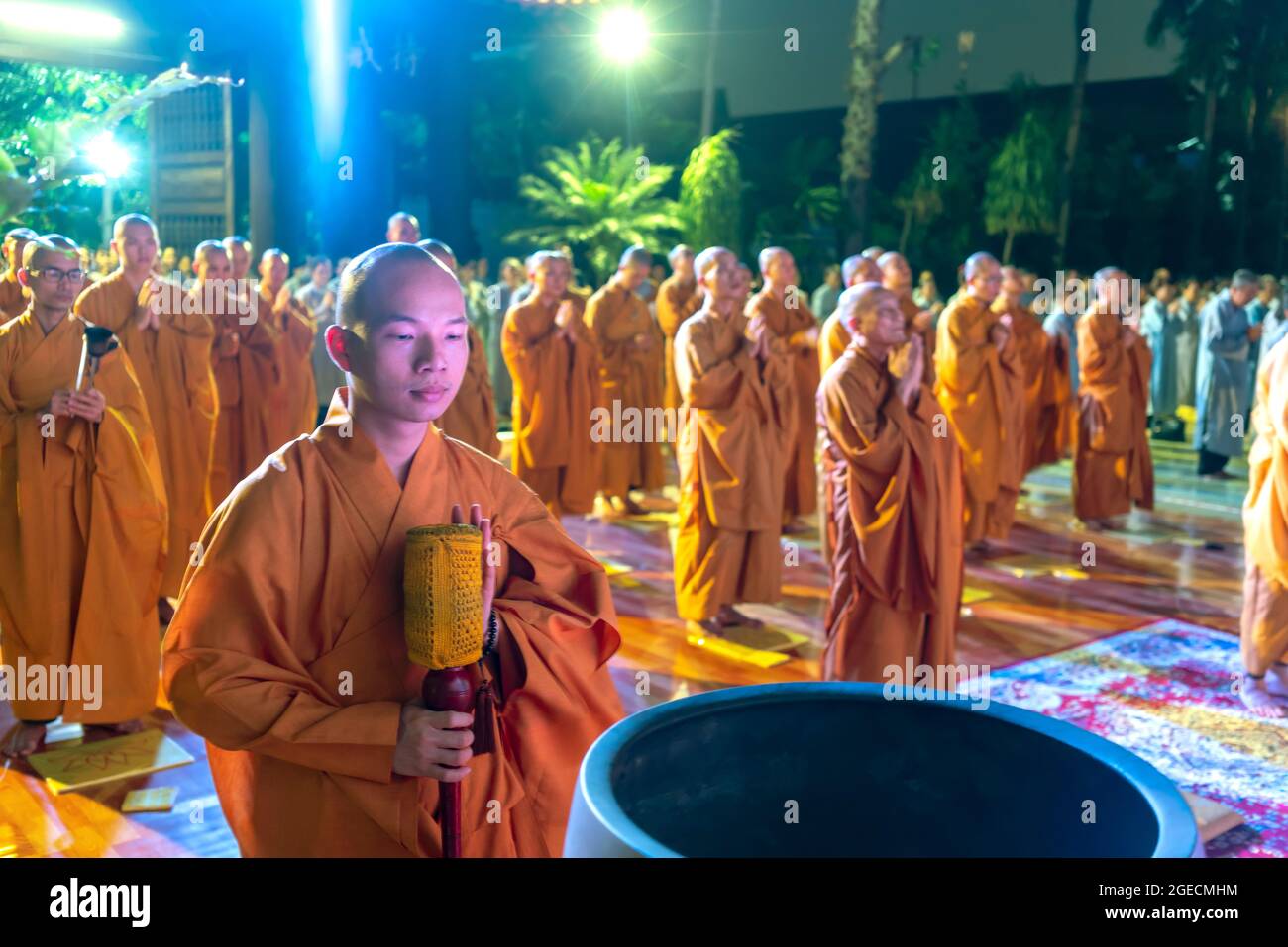 Kneeling monks in temple praying hi-res stock photography and images ...