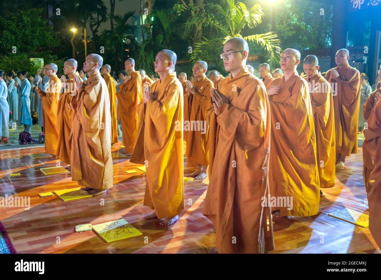 Kneeling monks in temple praying hi-res stock photography and images ...