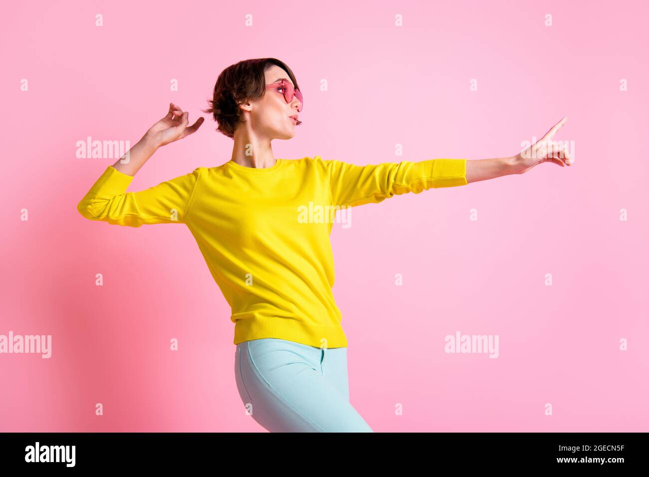 Profile side photo of young lovely pretty smiling cheerful girl dancing ...
