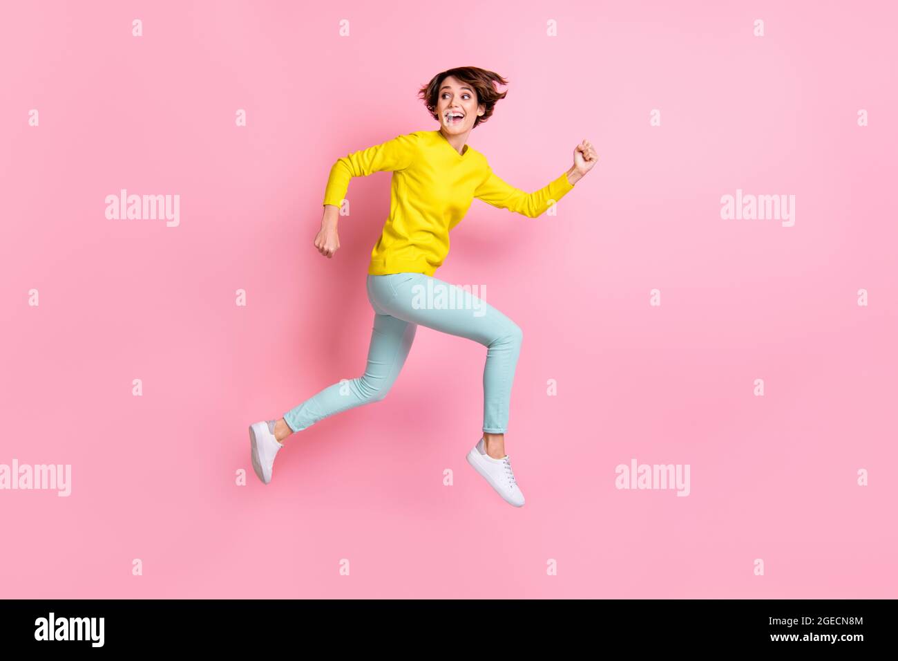 Full length body size photo of woman jumping high running fast looking ...