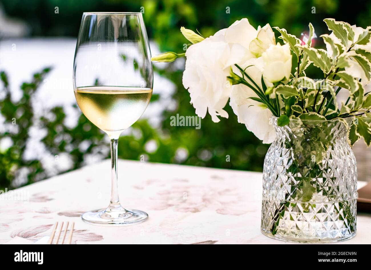 White wine in luxury restaurant on summer garden terrace, wine tasting ...