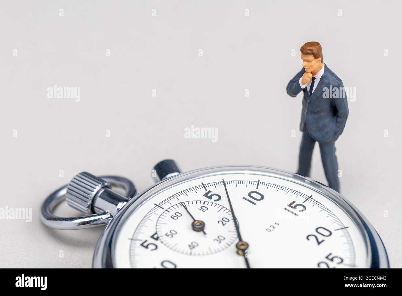 Businessman in a suit looks at the stopwatch. Fast business solution ...