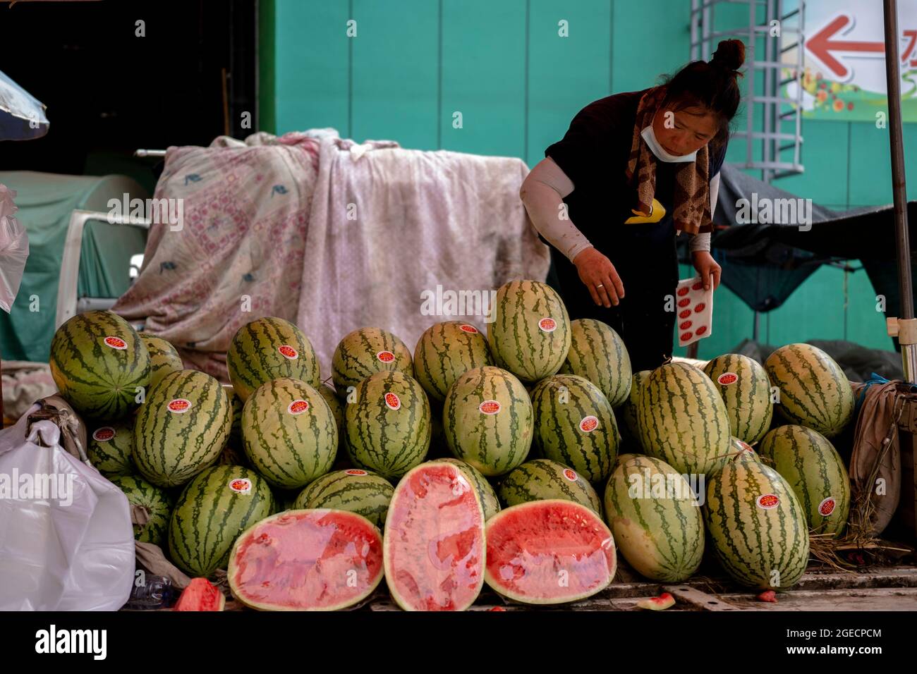 A vendor of watermelon in a market of agricultural products Stock Photo ...