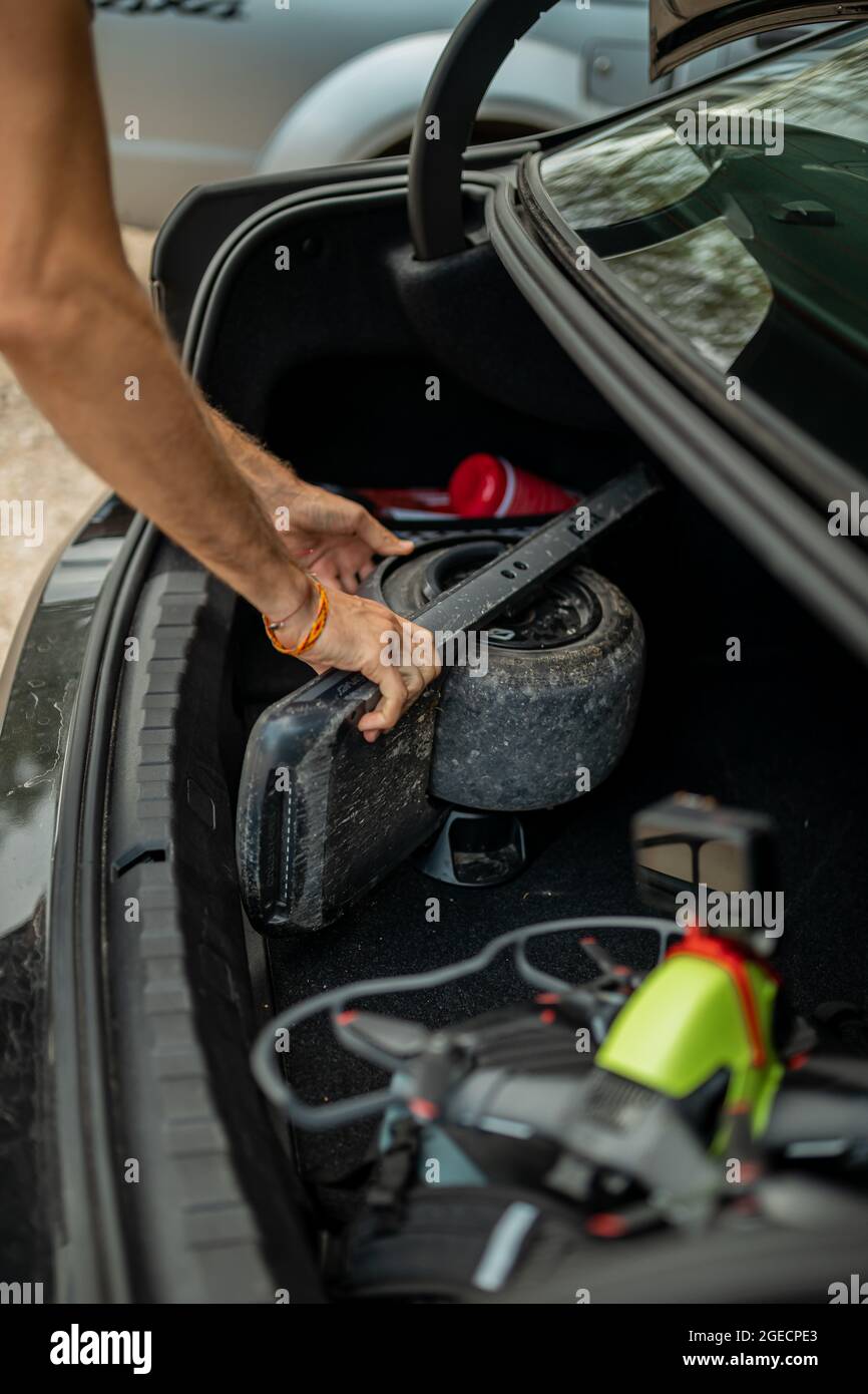 Girl loading luggage into car hi-res stock photography and images - Alamy