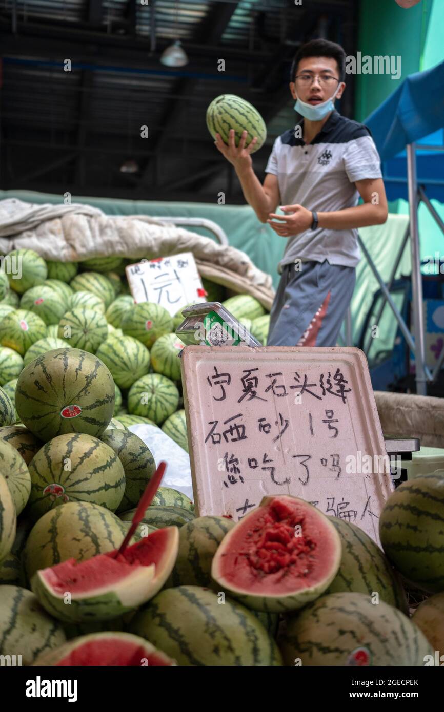 A vendor of watermelon in a market of agricultural products Stock Photo ...