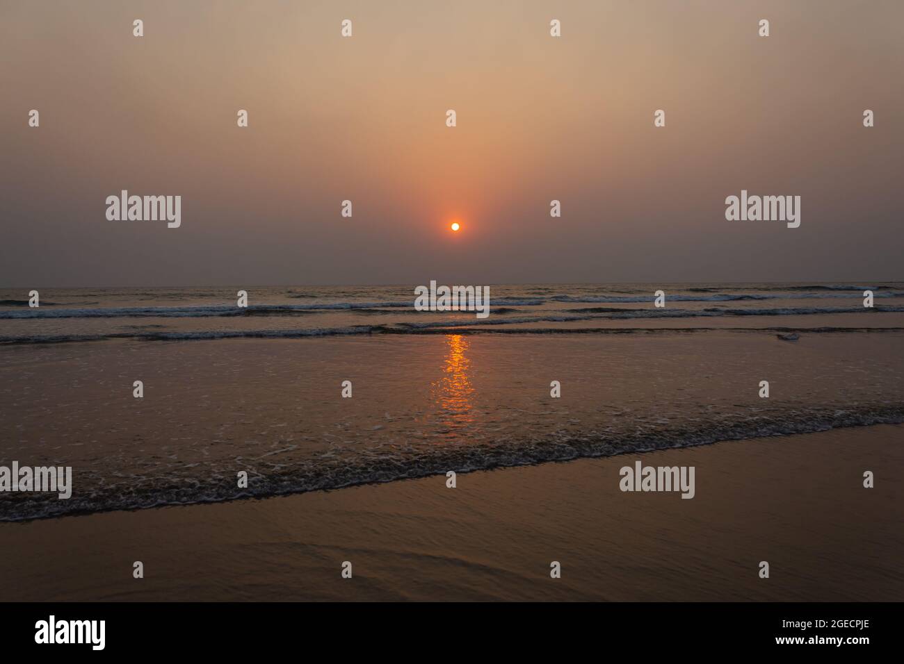 the beautiful view of sunset from seaside, with sea waves Stock Photo ...