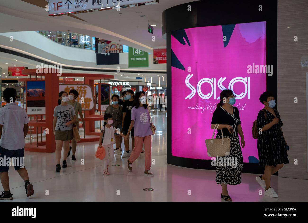 Chinese customers wear face masks shopping in a department store Stock ...