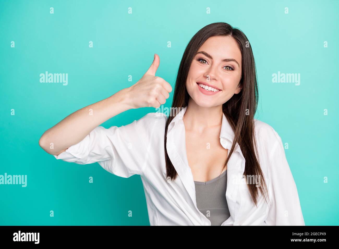 Photo of cheerful happy nice young woman make thumb-up recommend advert ...