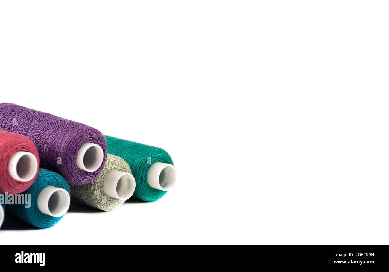 Spools of thread isolated on white with space for text. Horizontal ...