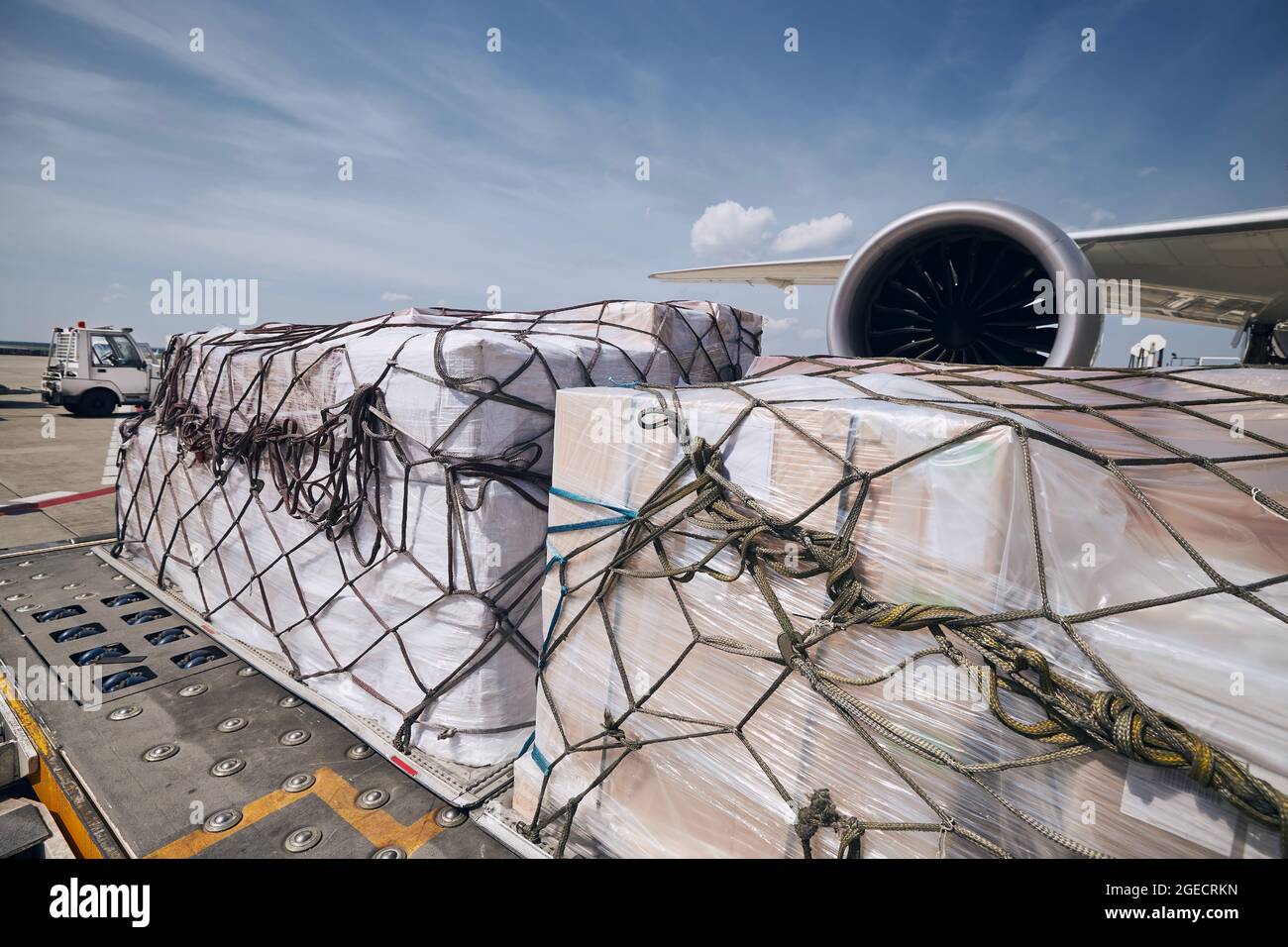 Preparation before flight. Loading of cargo containers against jet ...
