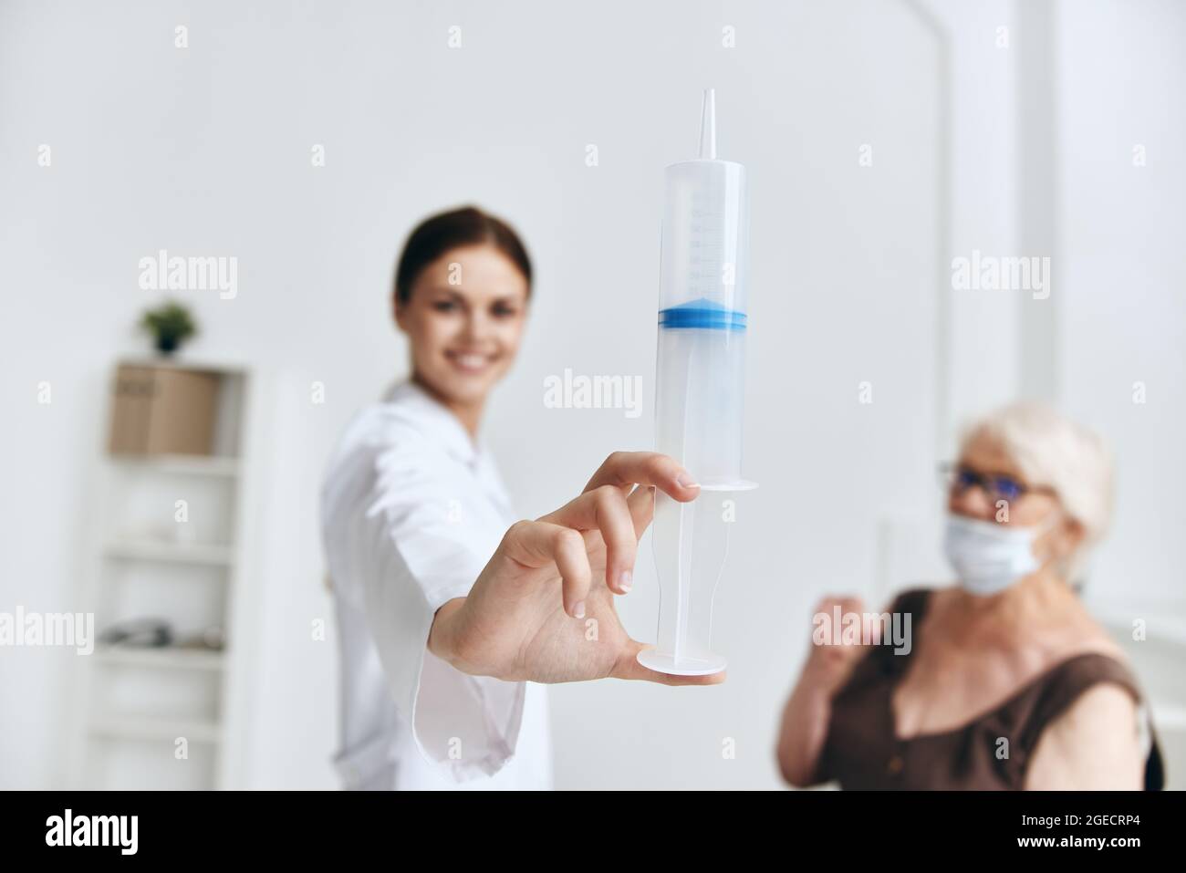 emotional nurse and patient hand injection fun Stock Photo - Alamy