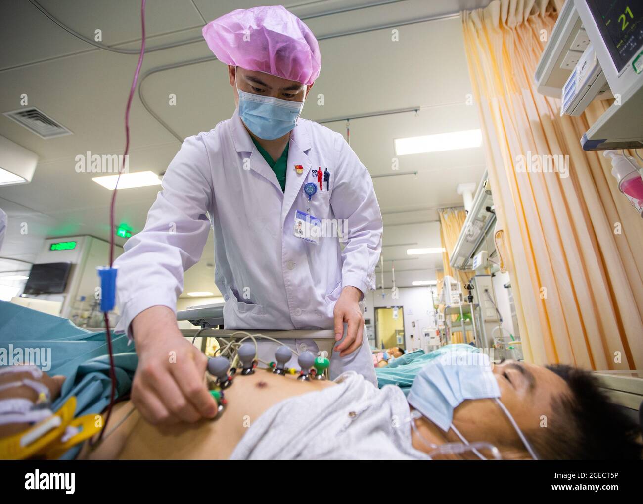 NANJING, CHINA - AUGUST 19, 2021 - A doctor performs an ...