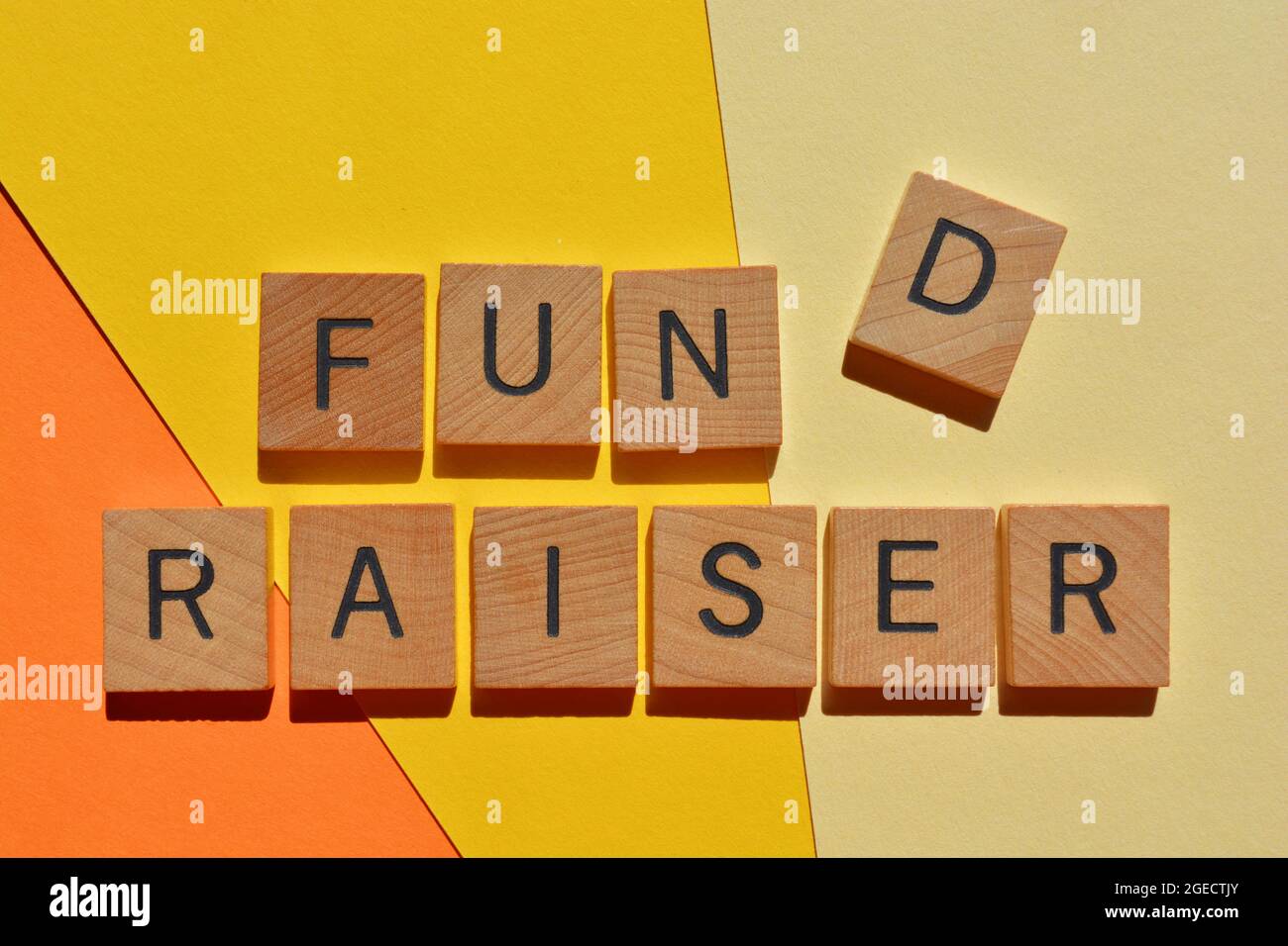 Fun, Fund Raiser, play on words in wooden alphabet letters isolated on ...
