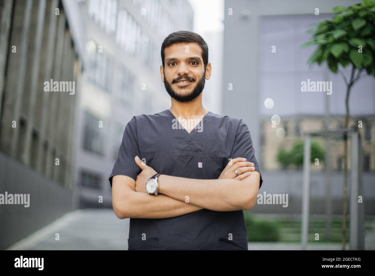 Close up portrait of young professional male Arabian doctor, wearing ...