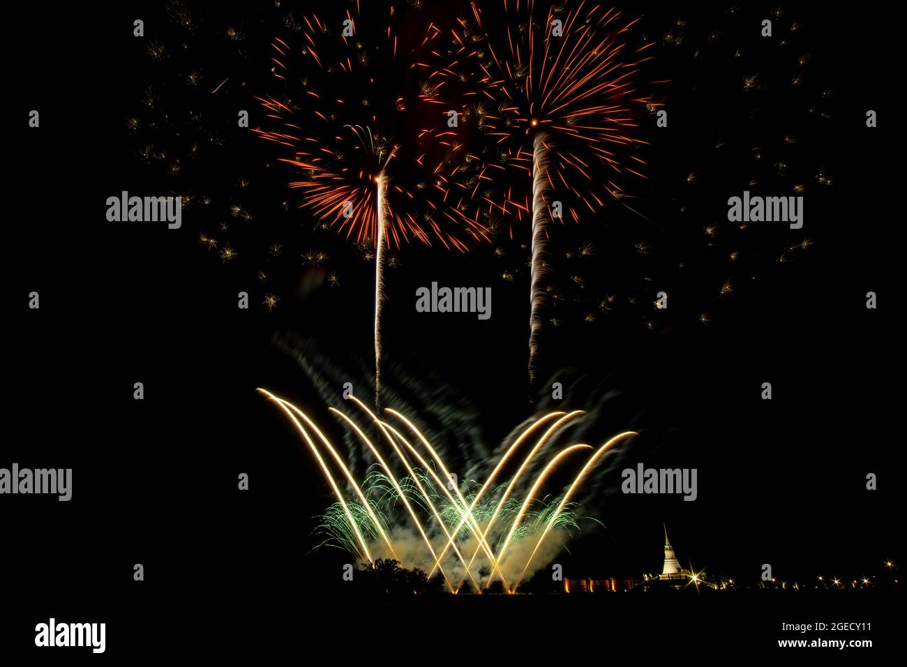 Huge, colorful fireworks over the rice fields at dusk Stock Photo - Alamy