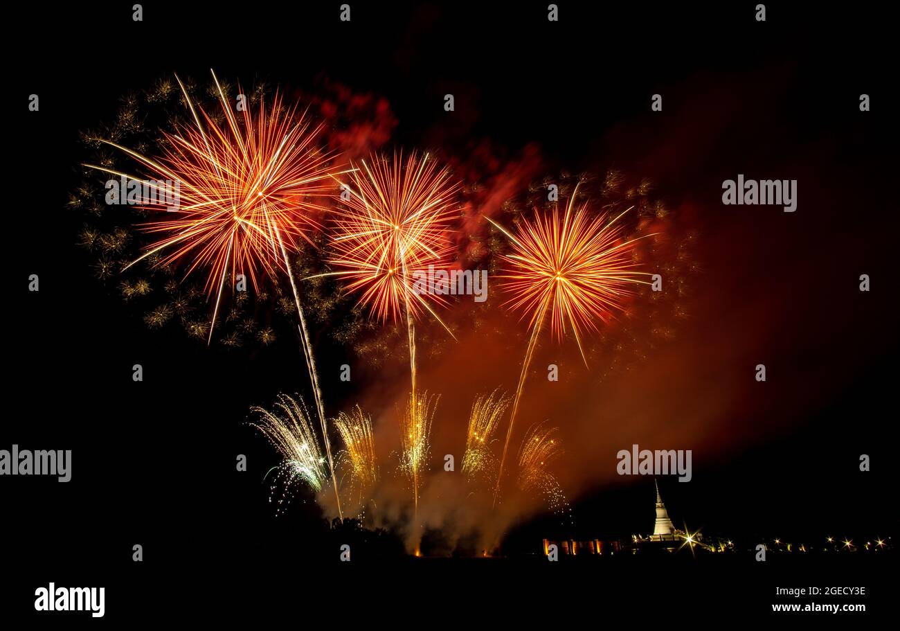 Huge, colorful fireworks over the rice fields at dusk Stock Photo - Alamy