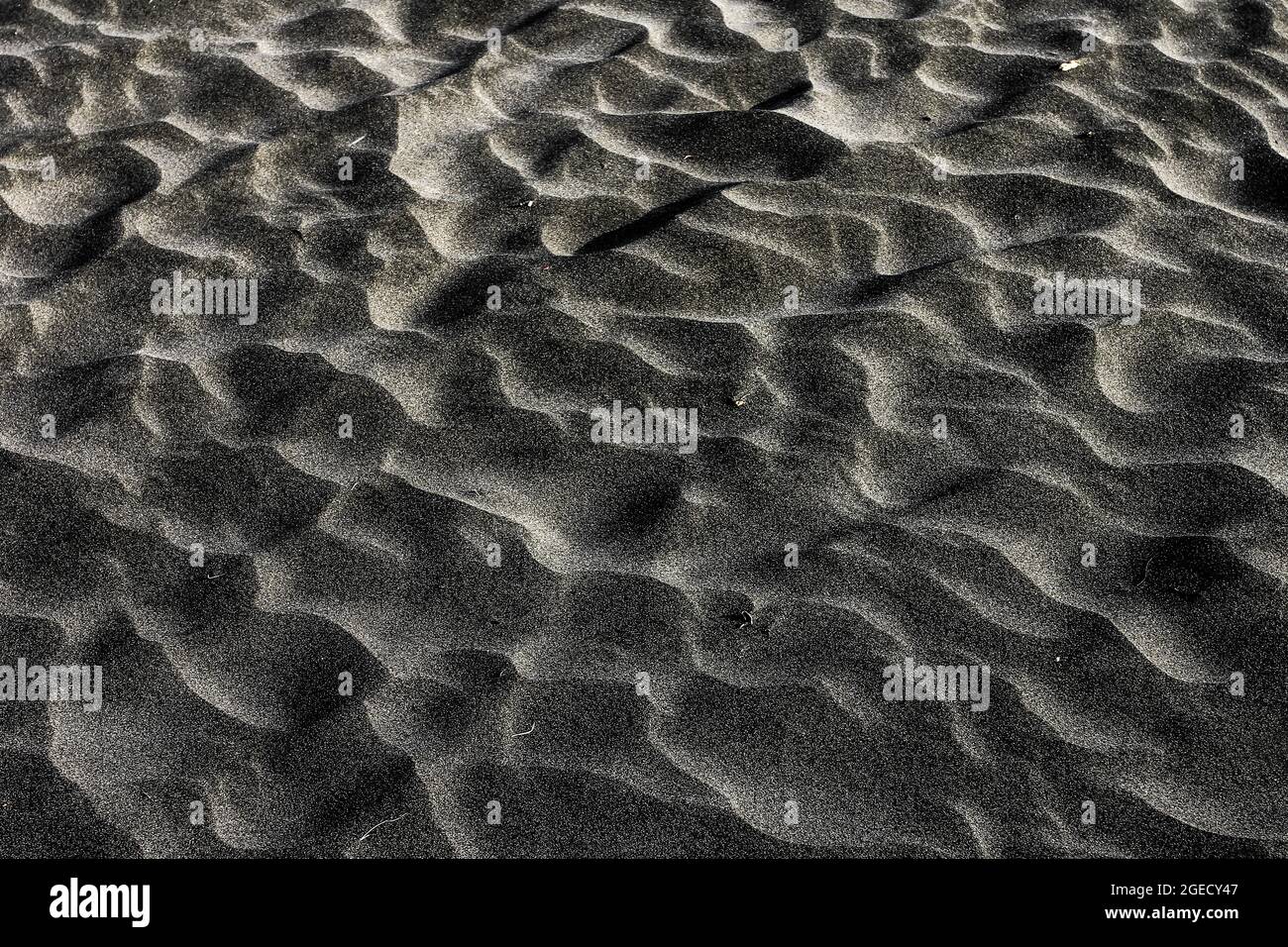 Closeup of the gray ocean beach sand Stock Photo - Alamy