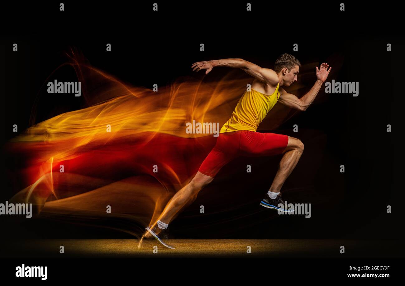 Portrait of young man, professional male athlete, runner in motion and ...