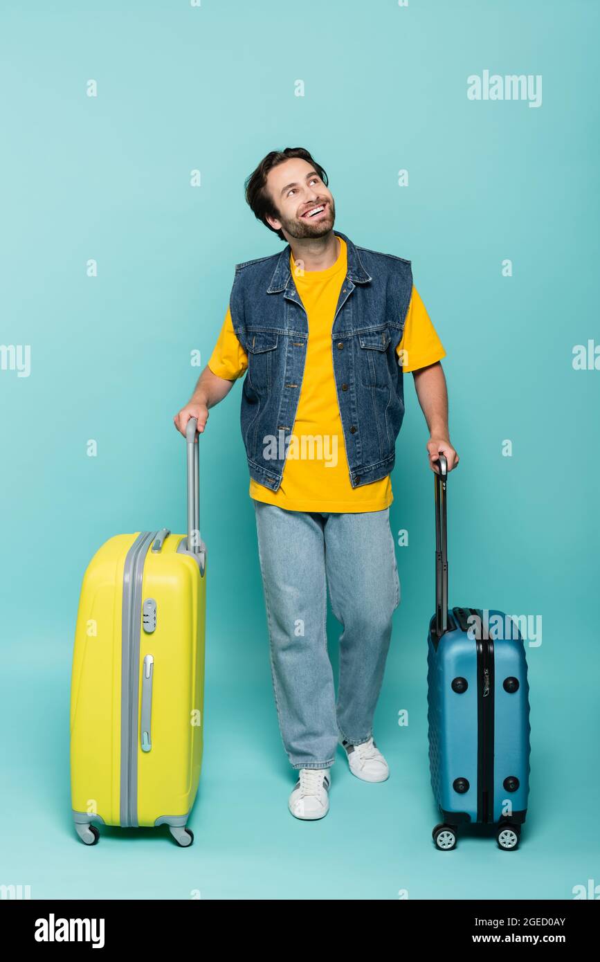 Positive man tourist baggage hi-res stock photography and images - Alamy