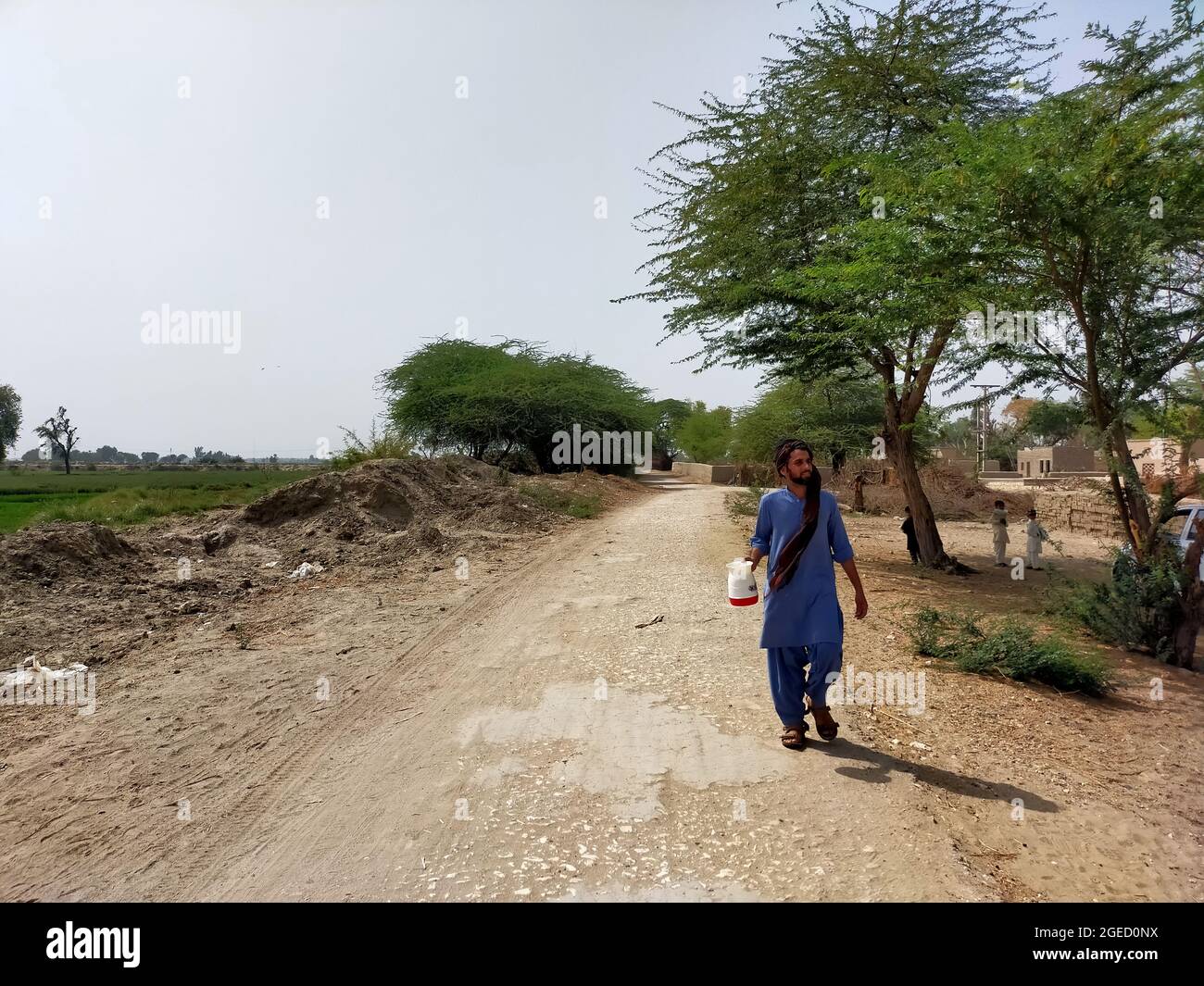 PANO AQIL, PAKISTAN - Mar 16, 2021: A man walking in the village ...